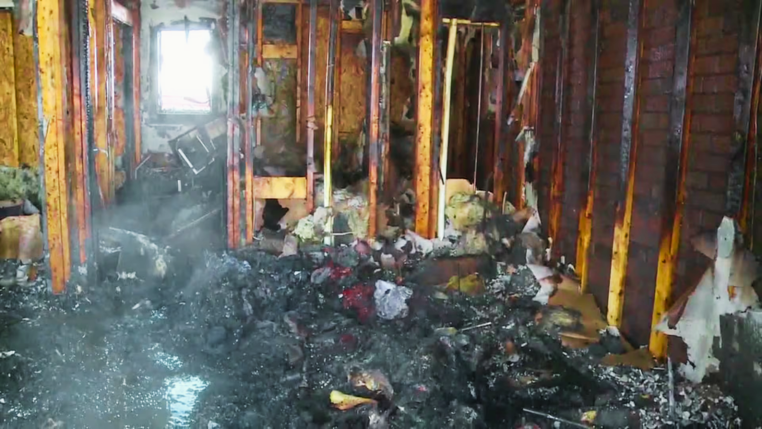 Woman Pulled From Burning Home in Critical Condition After Dramatic ...